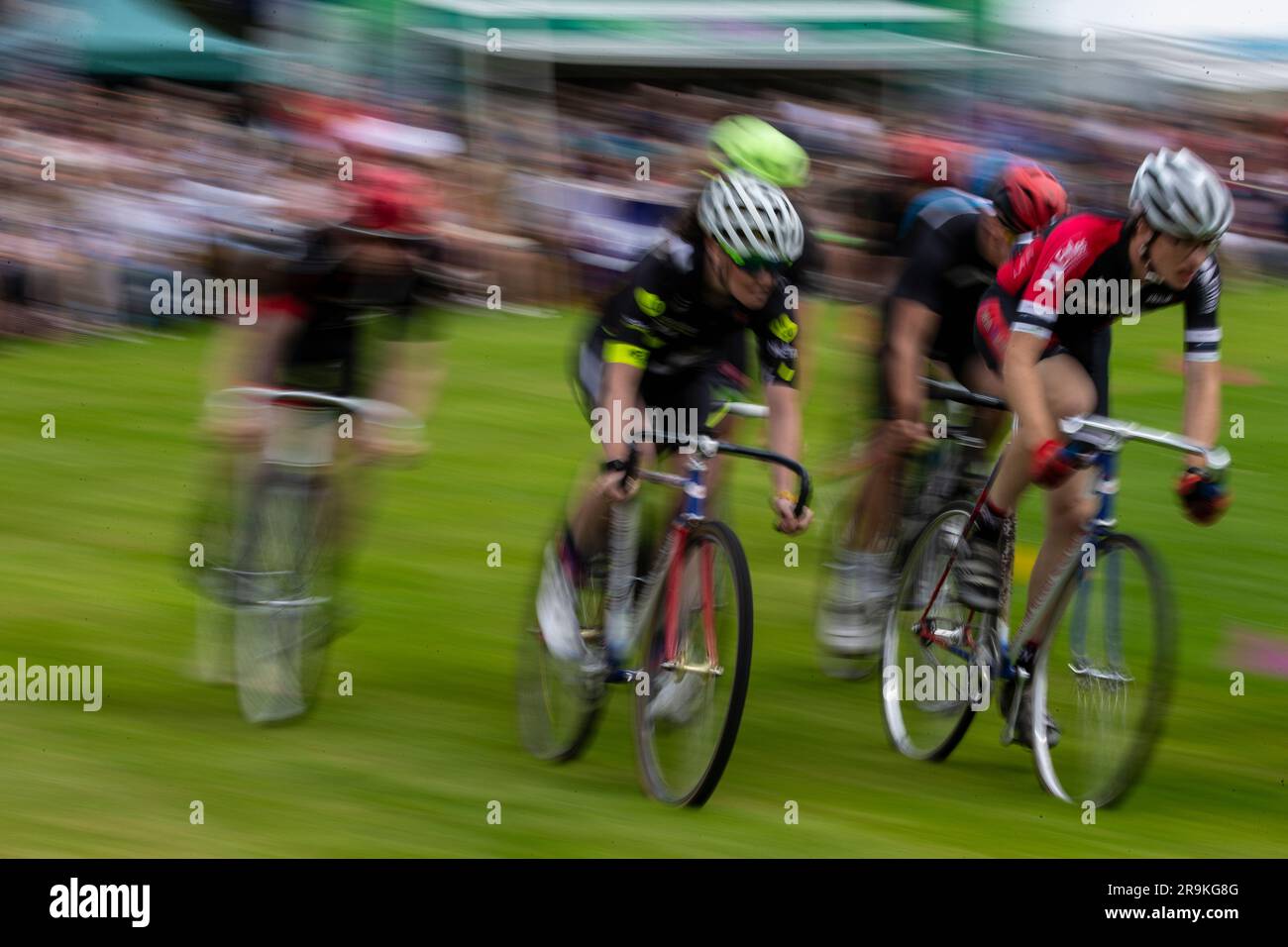 Motion blur as Elite cyclists compete in the bicycle circuit race at ...