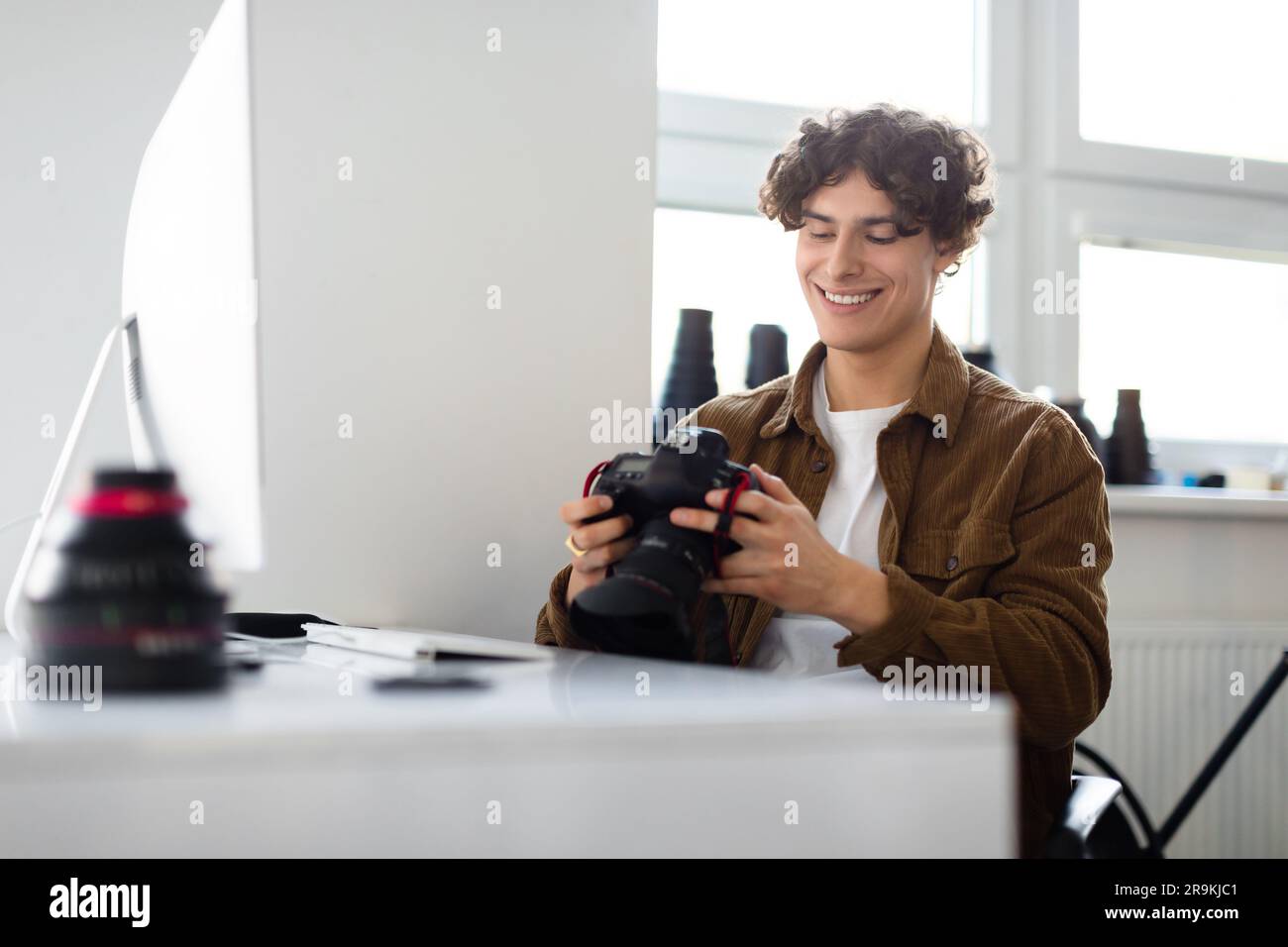 Modern arts and creative career concept. Happy smiling photographer man ...