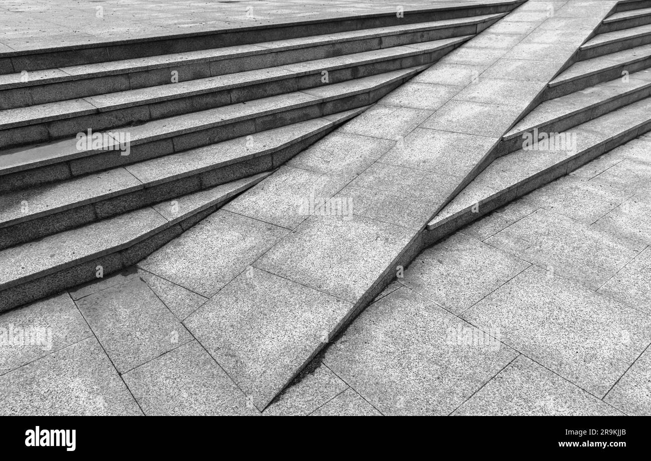 Gray granite stairs with a ramp, abstract outdoor urban architecture ...