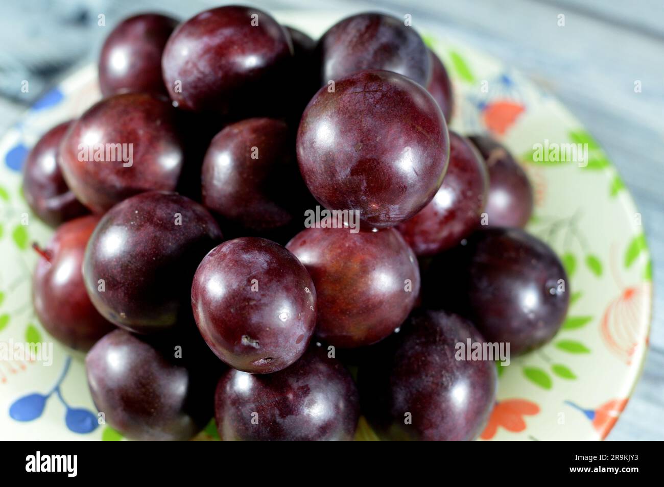 pile of plum fruit, A fruit of some species in Prunus subg. Prunus ...