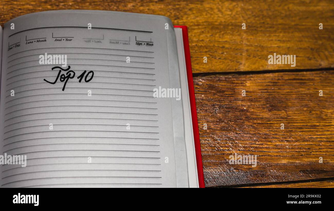 Top 10, handwriting text on page of office agenda. Copy space Stock ...