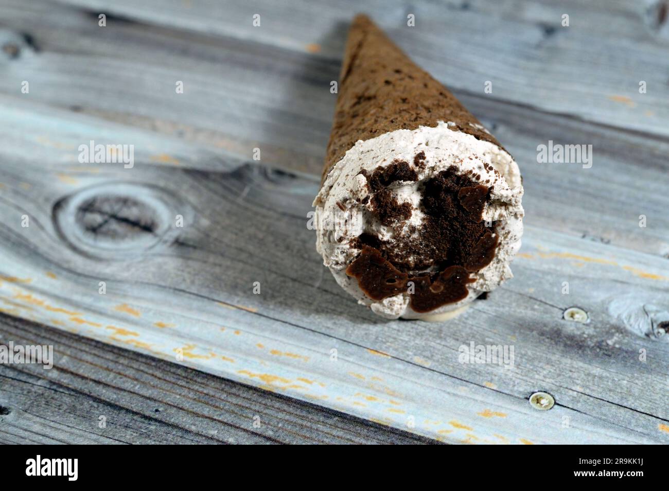 Ice cream of cocoa chocolate and vanilla cone with topping of chocolate ...