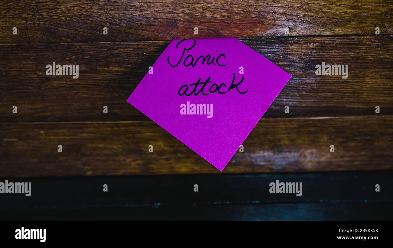 Writing Panic attack on memo post reminder. Text Panic attack on sticky ...