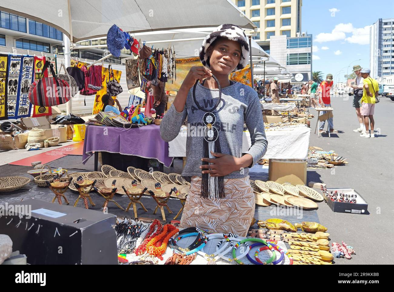 Windhoek, Namibia. 27th June, 2023. A woman displays an artistic item ...