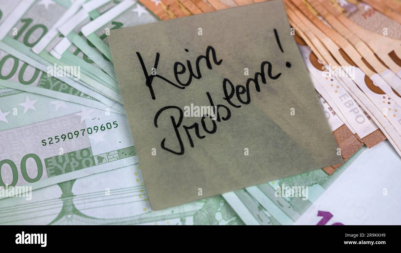 Sticky note on money. Text No problem in German on post it. Bucharest ...