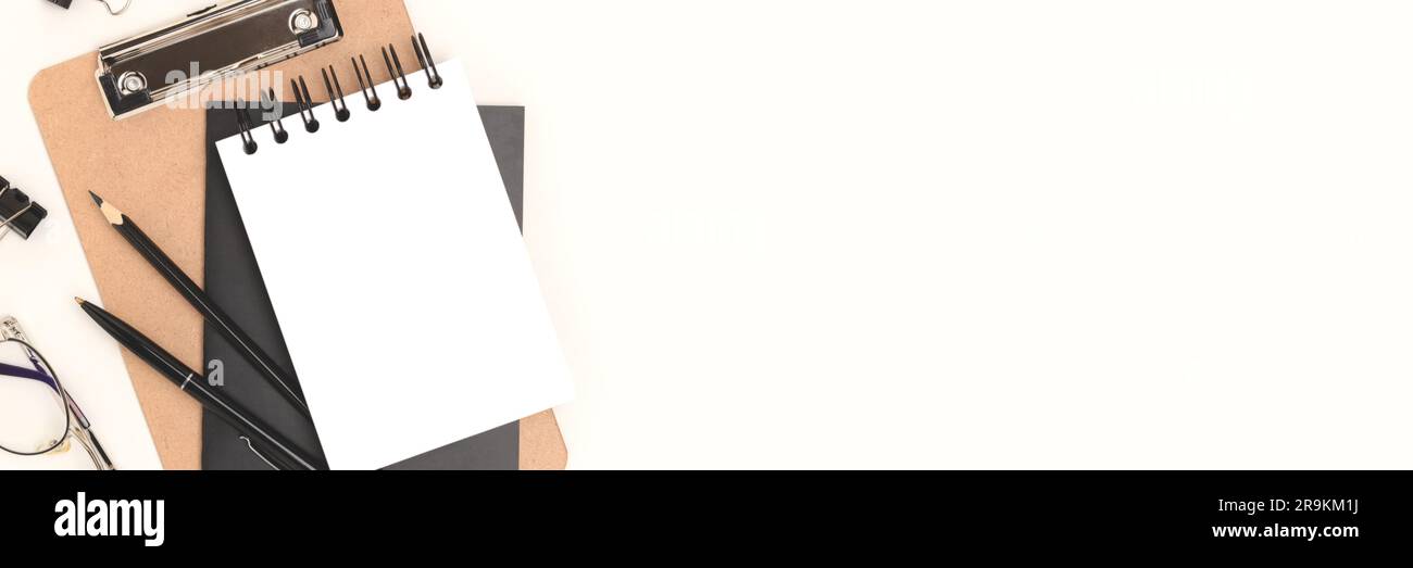 Banner with notepad mockup, eyeglasses and stationery on a beige ...