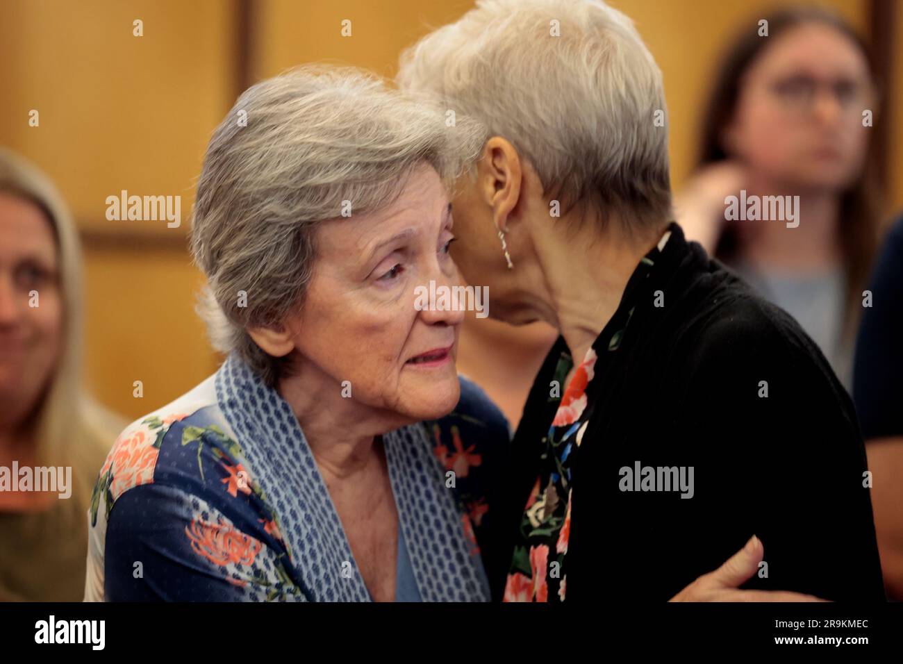 Family members of the victims embrace following the arraignment of ...