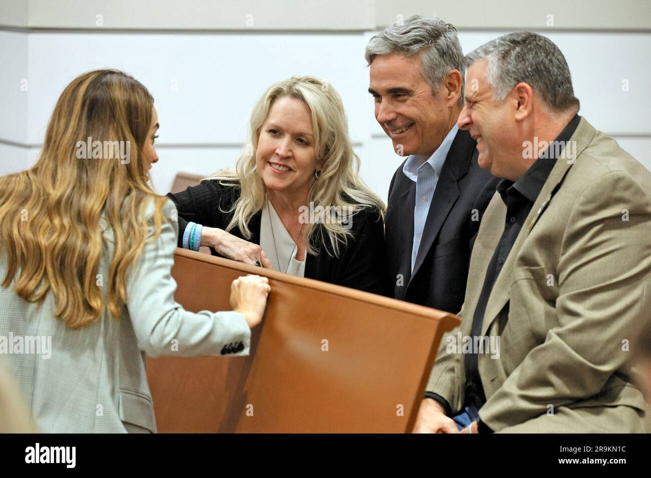 Gena and Tom Hoyer, center, and Tony Montalto, share a lighter moment ...