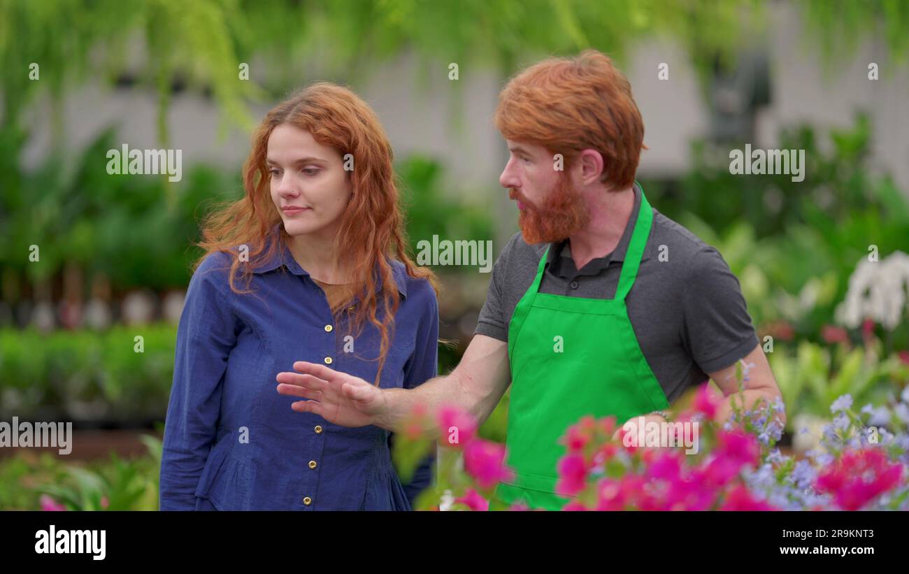 Male staff flower shop speaking hi-res stock photography and images - Alamy