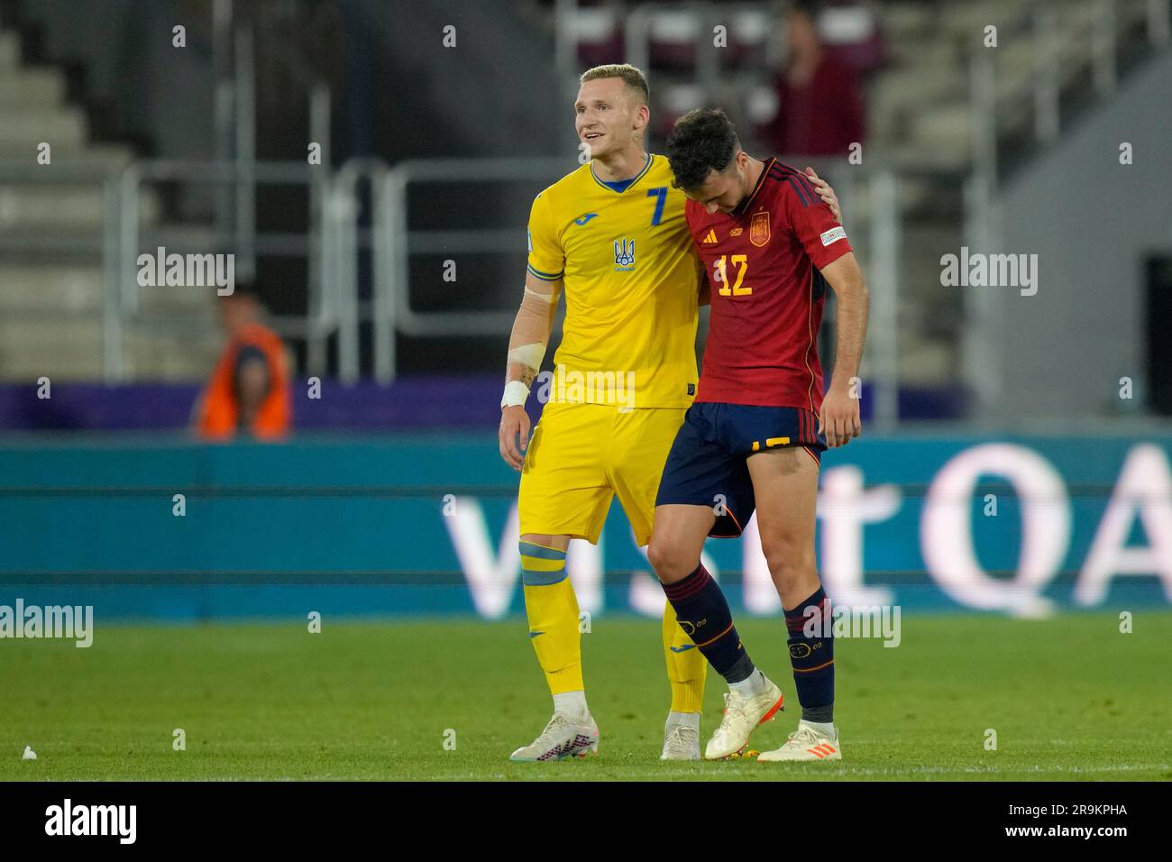 Ukraine's Bohdan Viunnyk hugs Arnau Martinez of Spain at the end of the Euro 2023 U21 ...