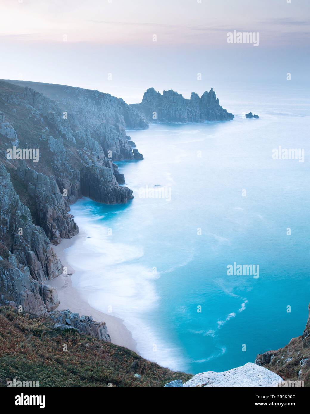 A picturesque scene featuring a stunning cliff overlooking a beautiful ...