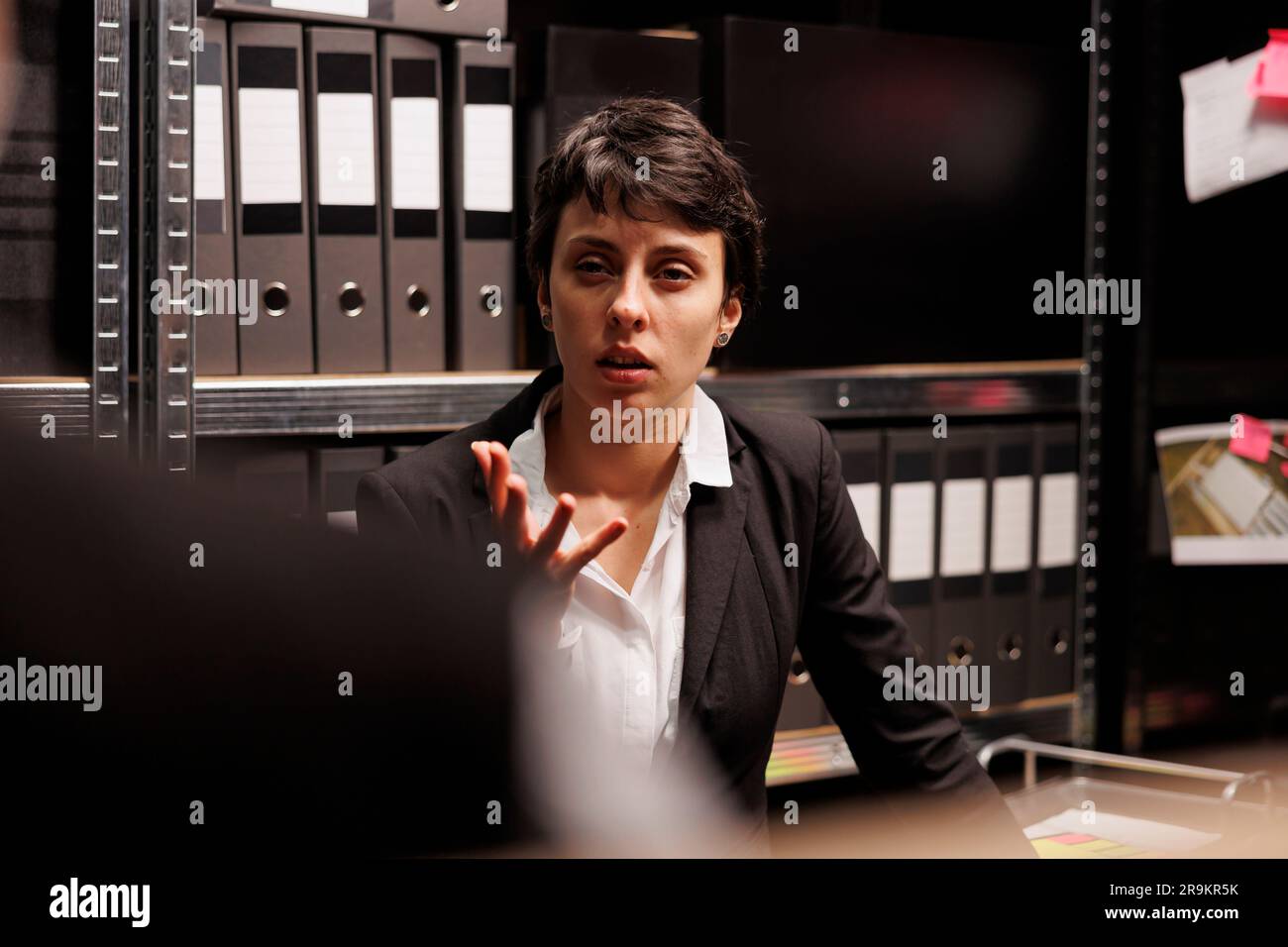 Private detective discussing missing person case with officer, working ...