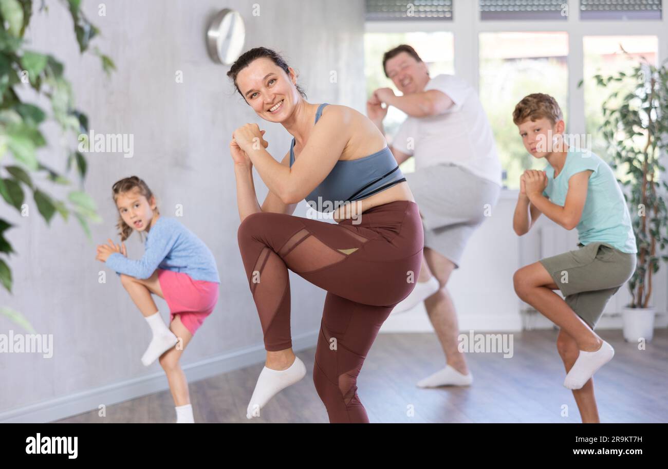 Family with two children dancing in studio Stock Photo - Alamy