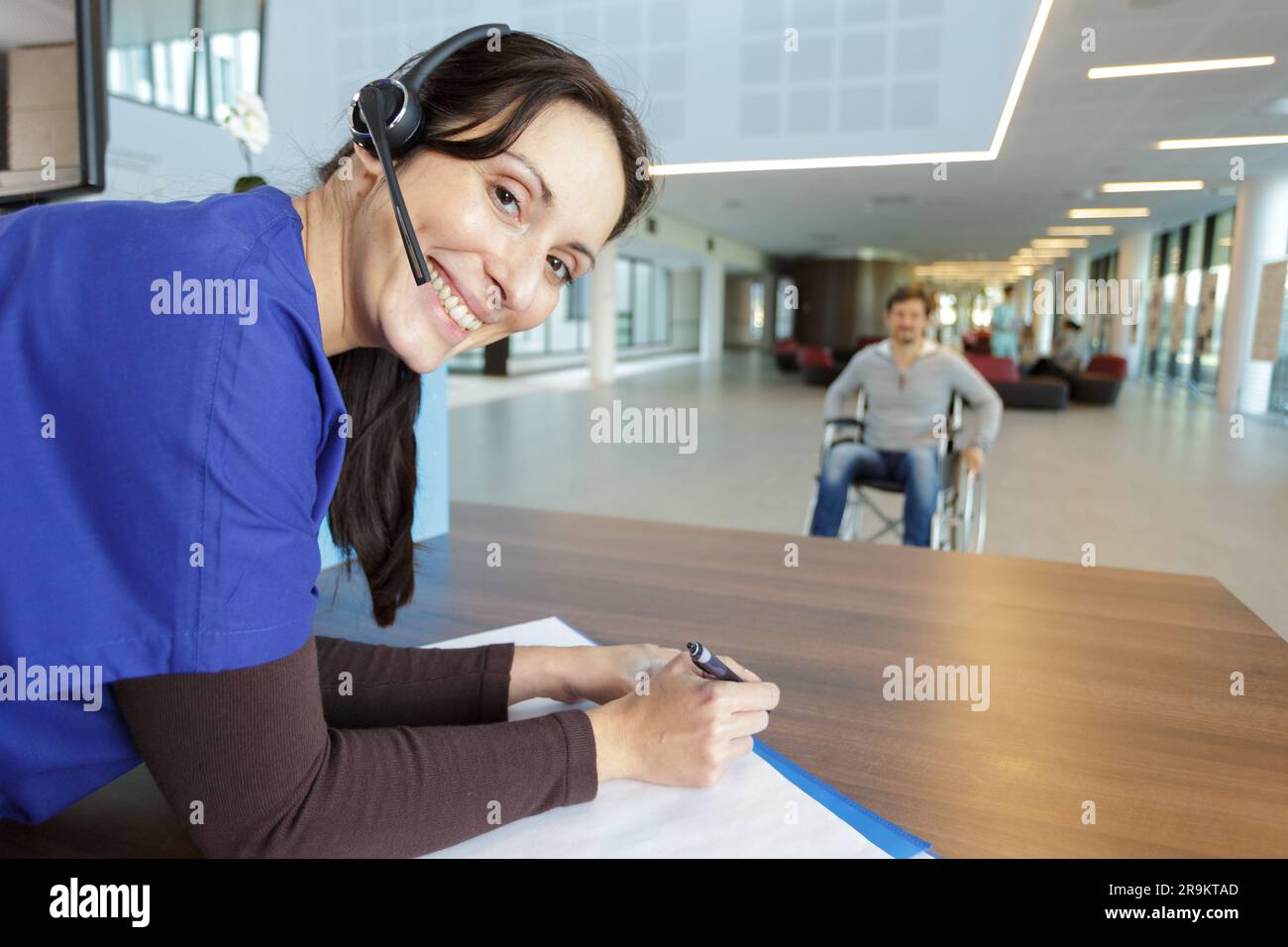 Portrait female hospital receptionist hi-res stock photography and images - Alamy