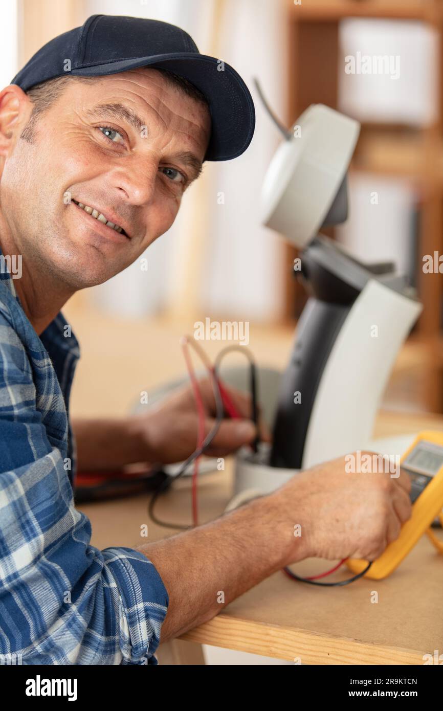 Happy man repairing coffee hi-res stock photography and images - Alamy
