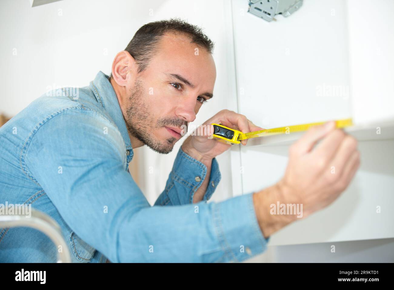 Using a measuring tape hi-res stock photography and images - Alamy