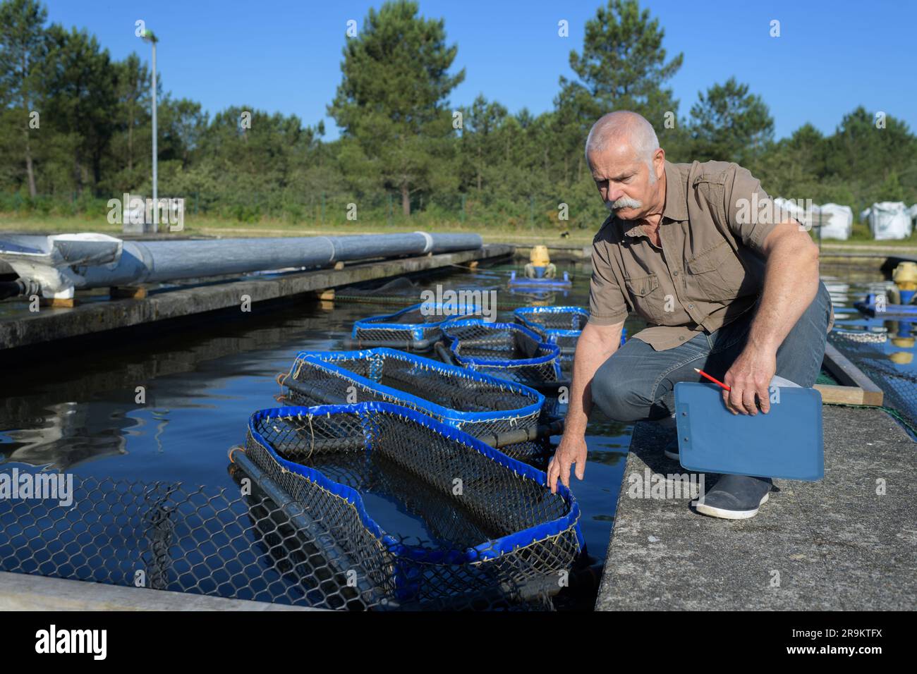 Farmer fishing with nets hi-res stock photography and images - Alamy