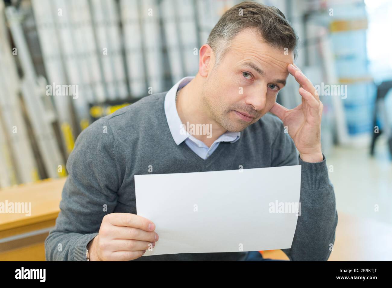Confused man papers hi-res stock photography and images - Alamy