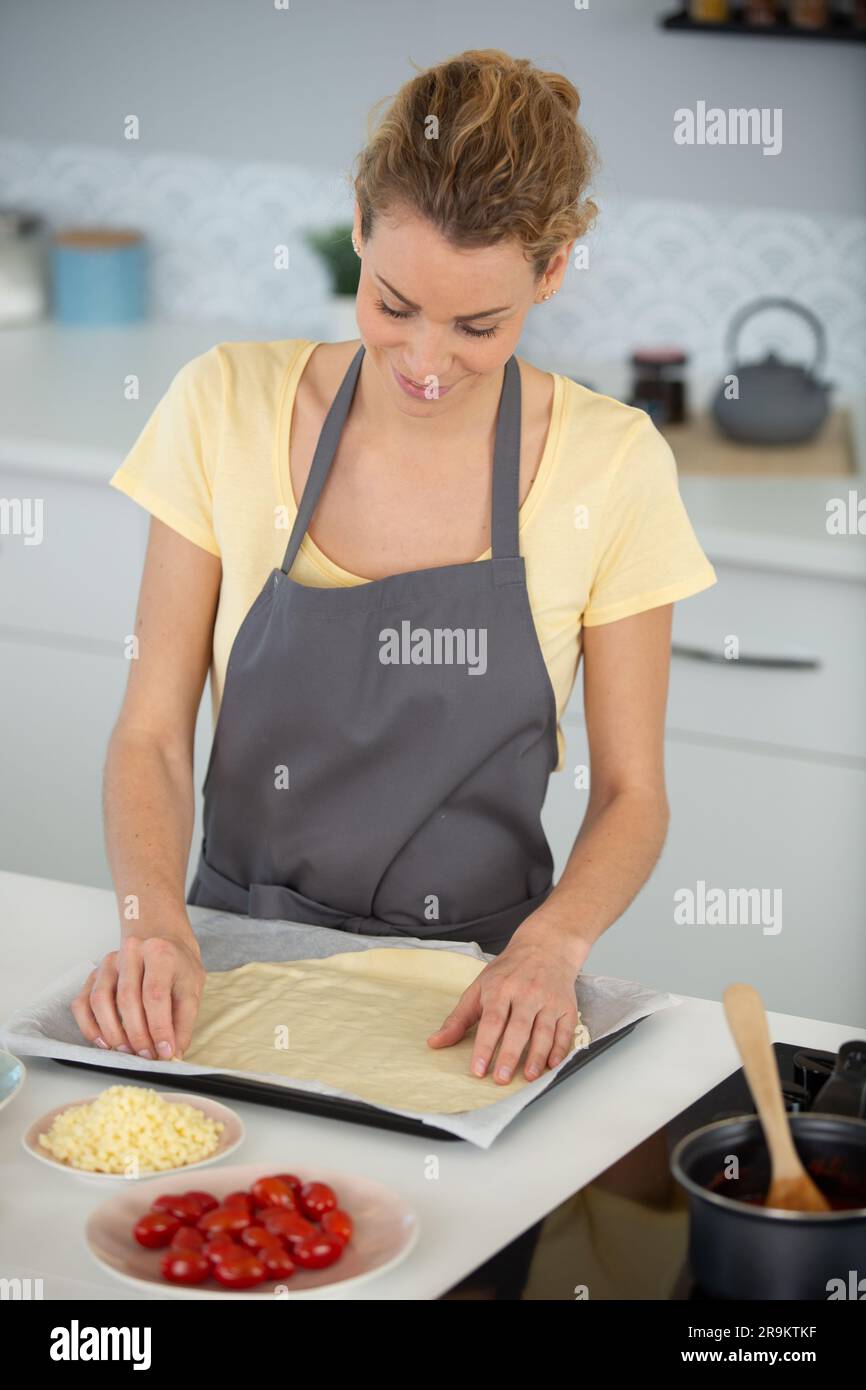 happy attractive woman lady housewife making pizza Stock Photo - Alamy