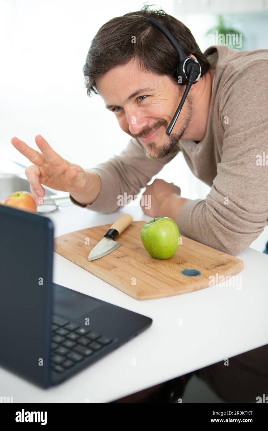 young business man having work conference while cooking Stock Photo - Alamy