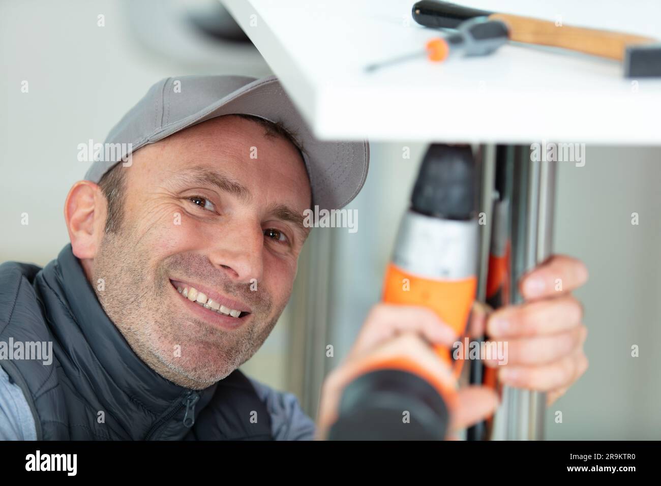 man repairing old damaged table Stock Photo - Alamy