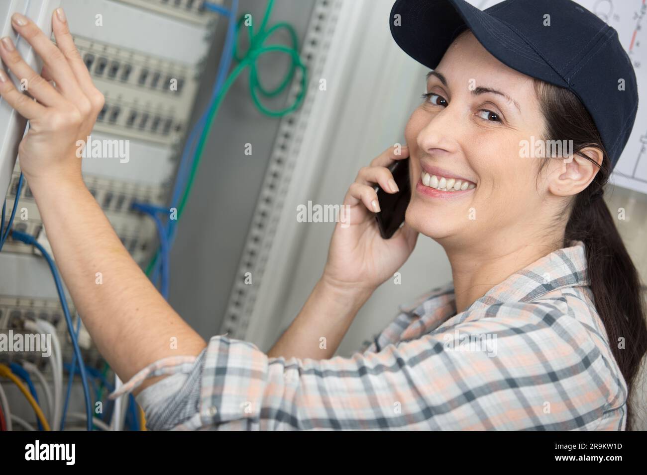 female electrician working on a electrical board Stock Photo - Alamy