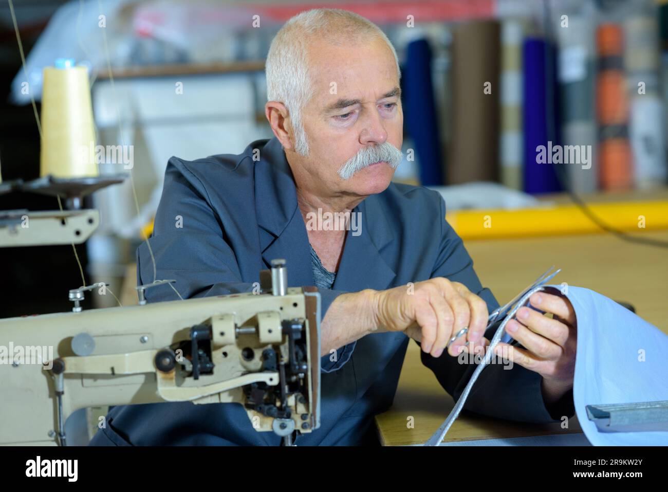 Tailor sitting hi-res stock photography and images - Alamy