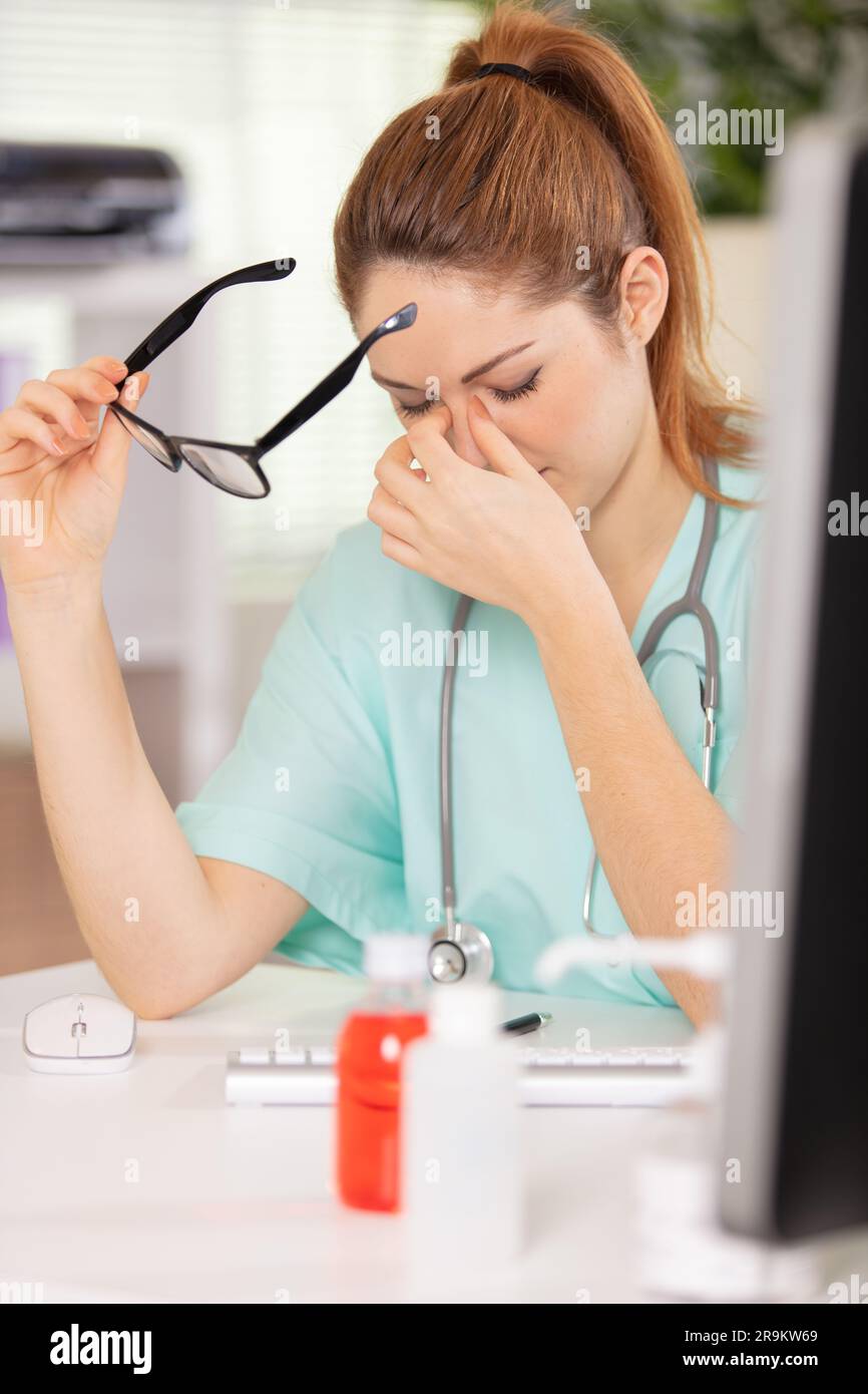 doctor feel tired sleeping on desk of clinic Stock Photo - Alamy
