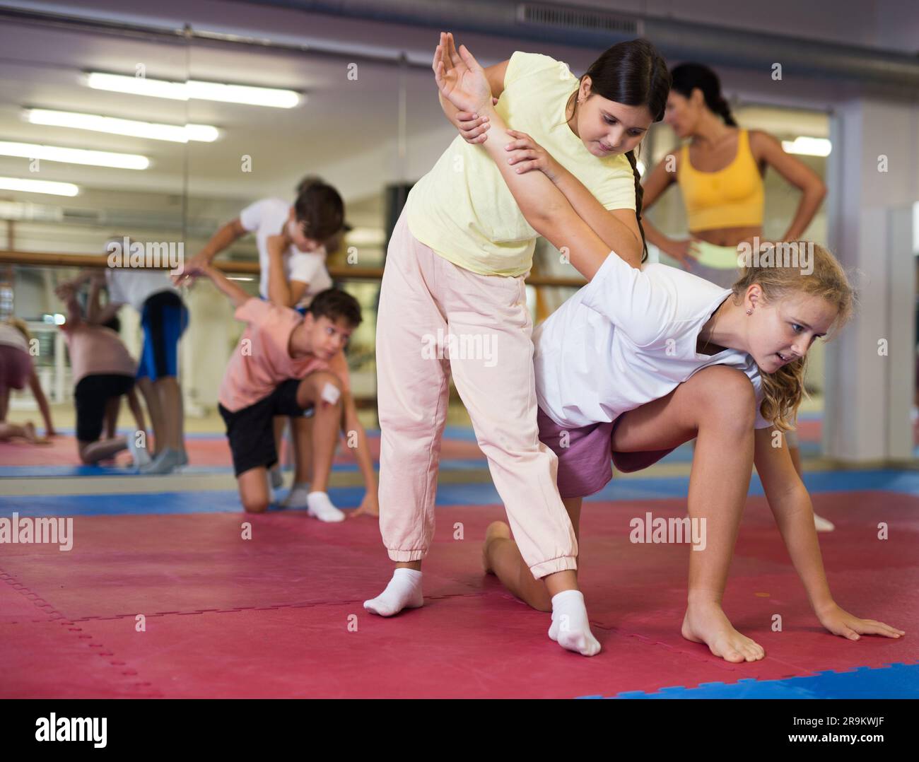 Two school girls practicing self-defense moves Stock Photo - Alamy