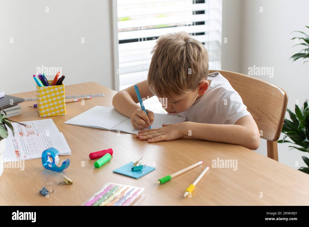 Cute boy doing school homework at home. Distance education. Online ...