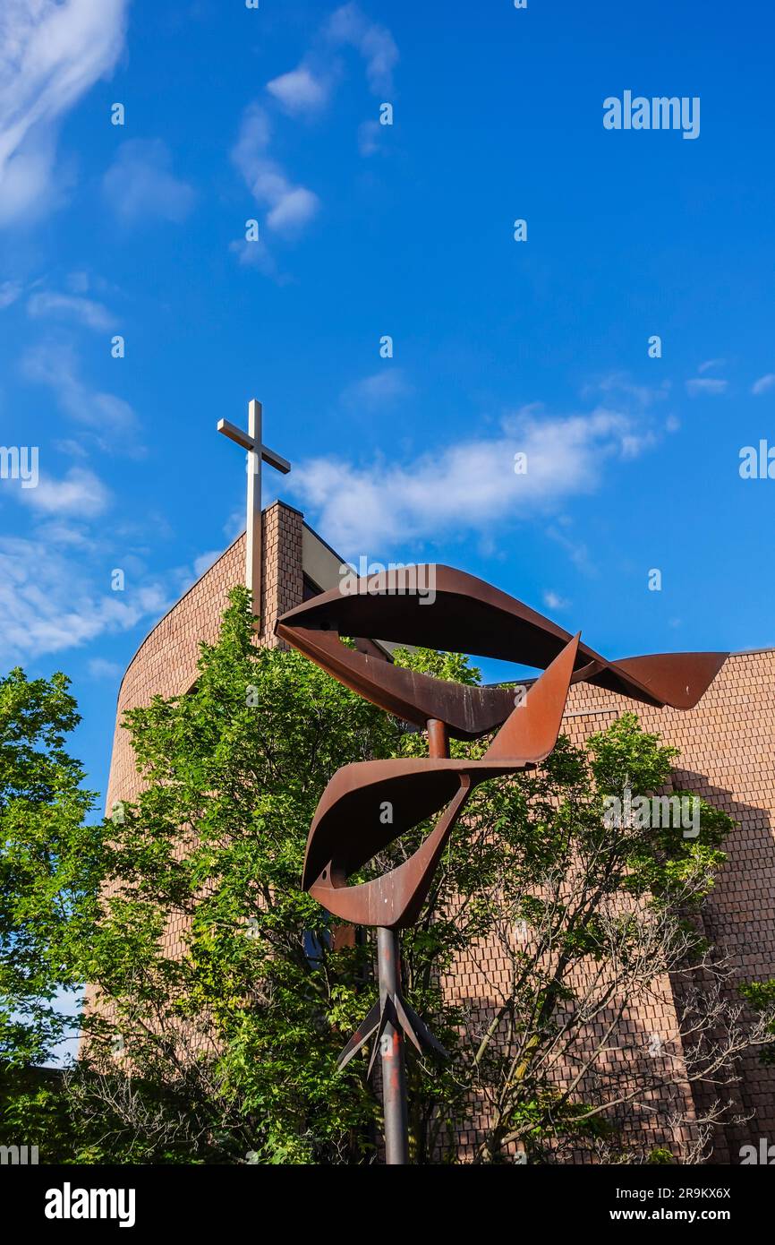 christian church building, cross on top, 2 fishes statue in front Stock ...