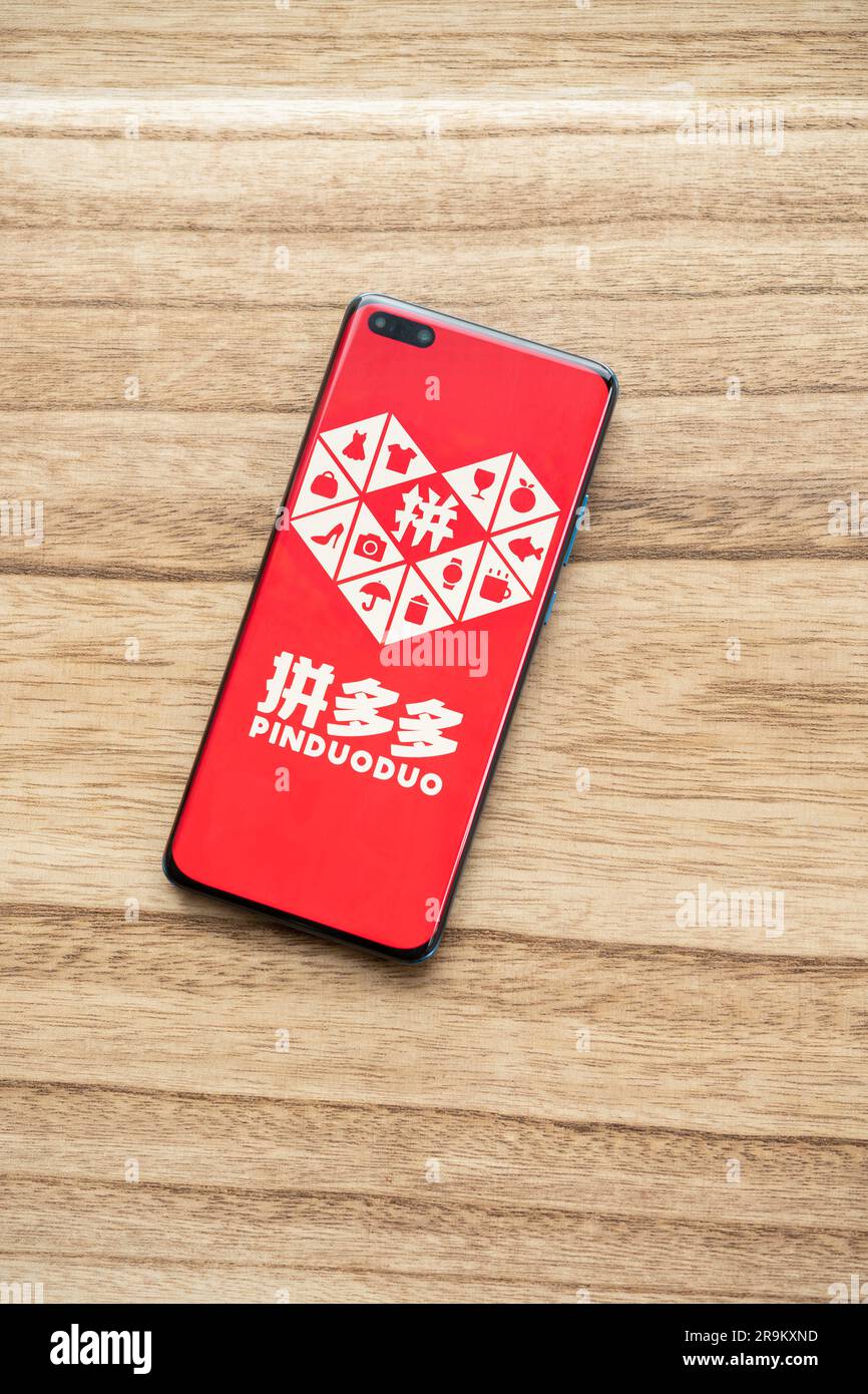 ZHONGSHAN China-June 26,2023:a mobile with PinDuoDuo logo at vertical ...