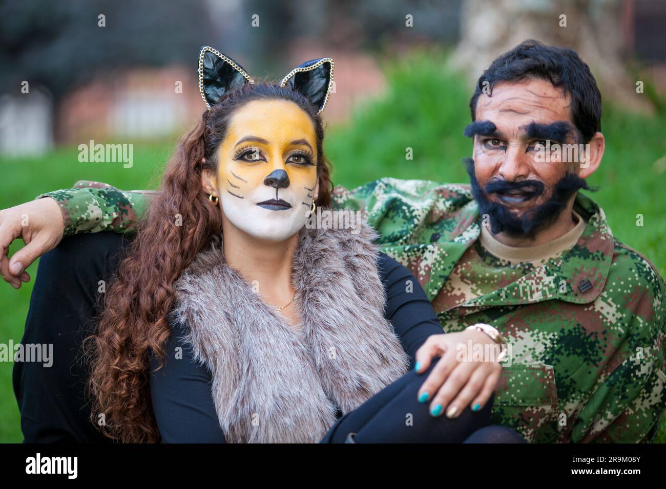 Young couple wearing wolf and woodcutter costumes. Real family having ...