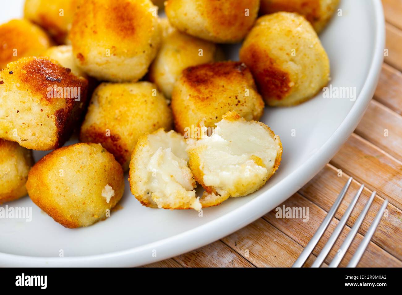 Savory deep-fried croquettes with crunchy coating and creamy cheese ...