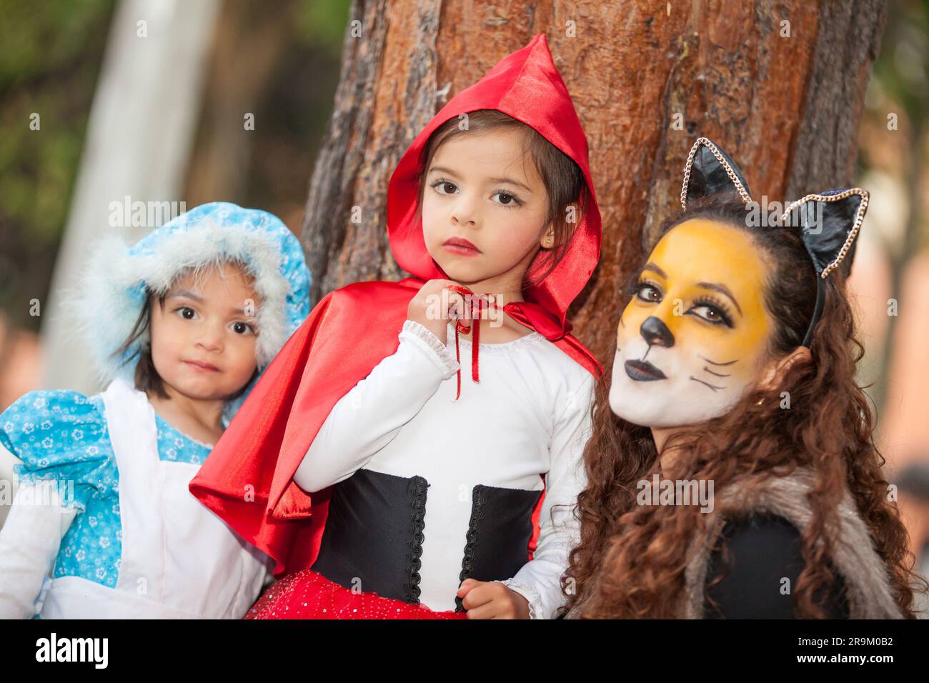 Real family having fun while using costumes of the Little red riding ...