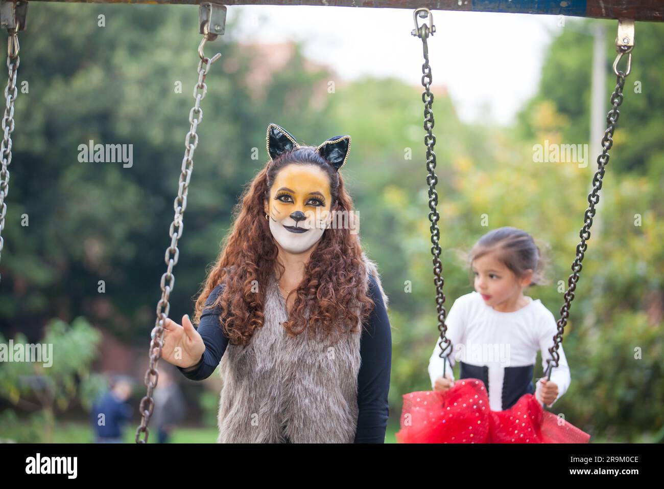 Real family having fun while using costumes of the Little red riding ...