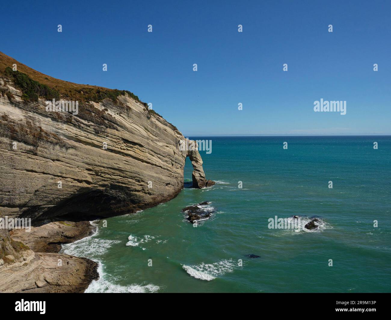 Oceanside cliff natural bridge arch rock formation, coastal nature ...