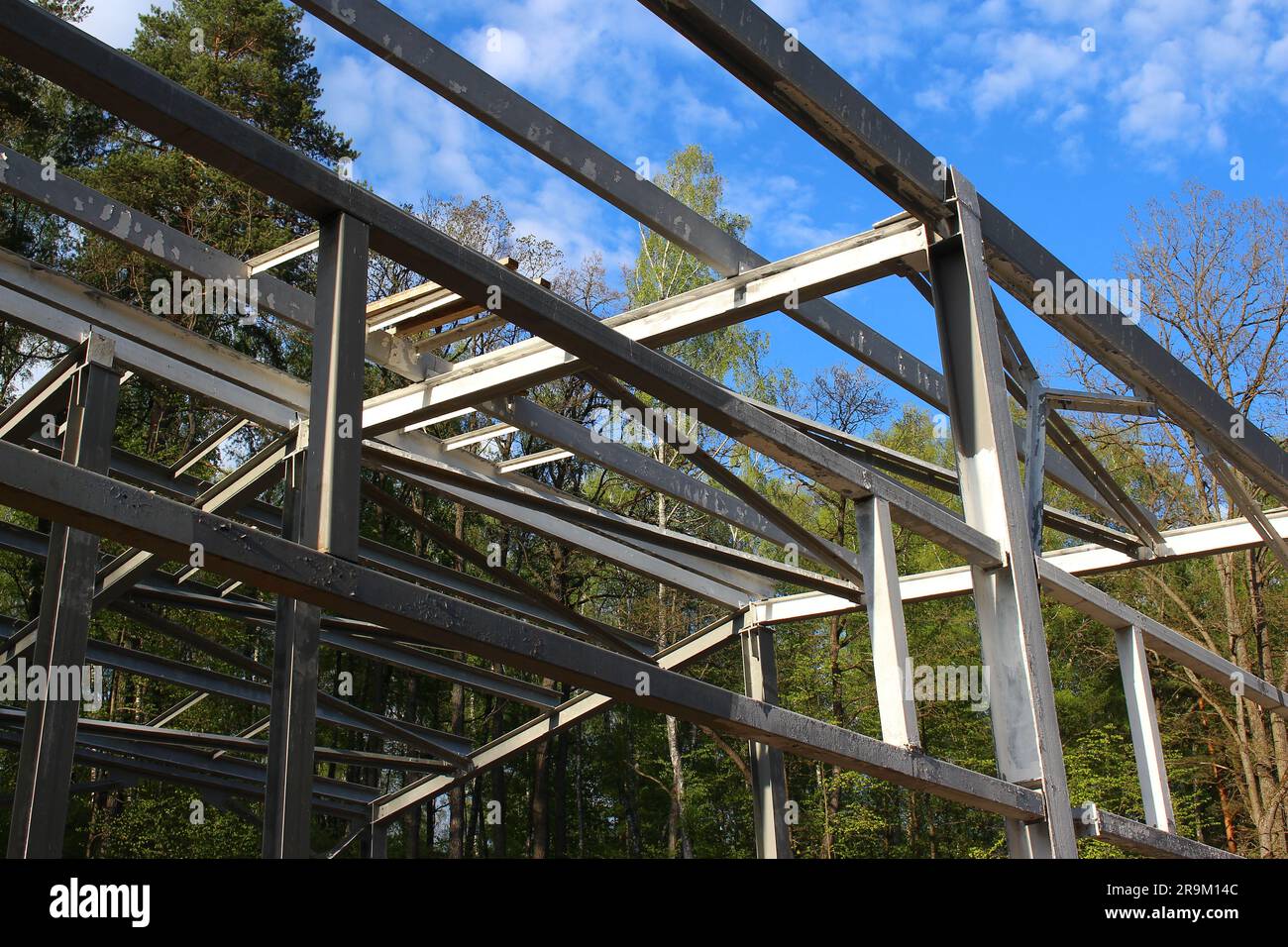 Frame of an industrial building made of welded metal beams Stock Photo ...