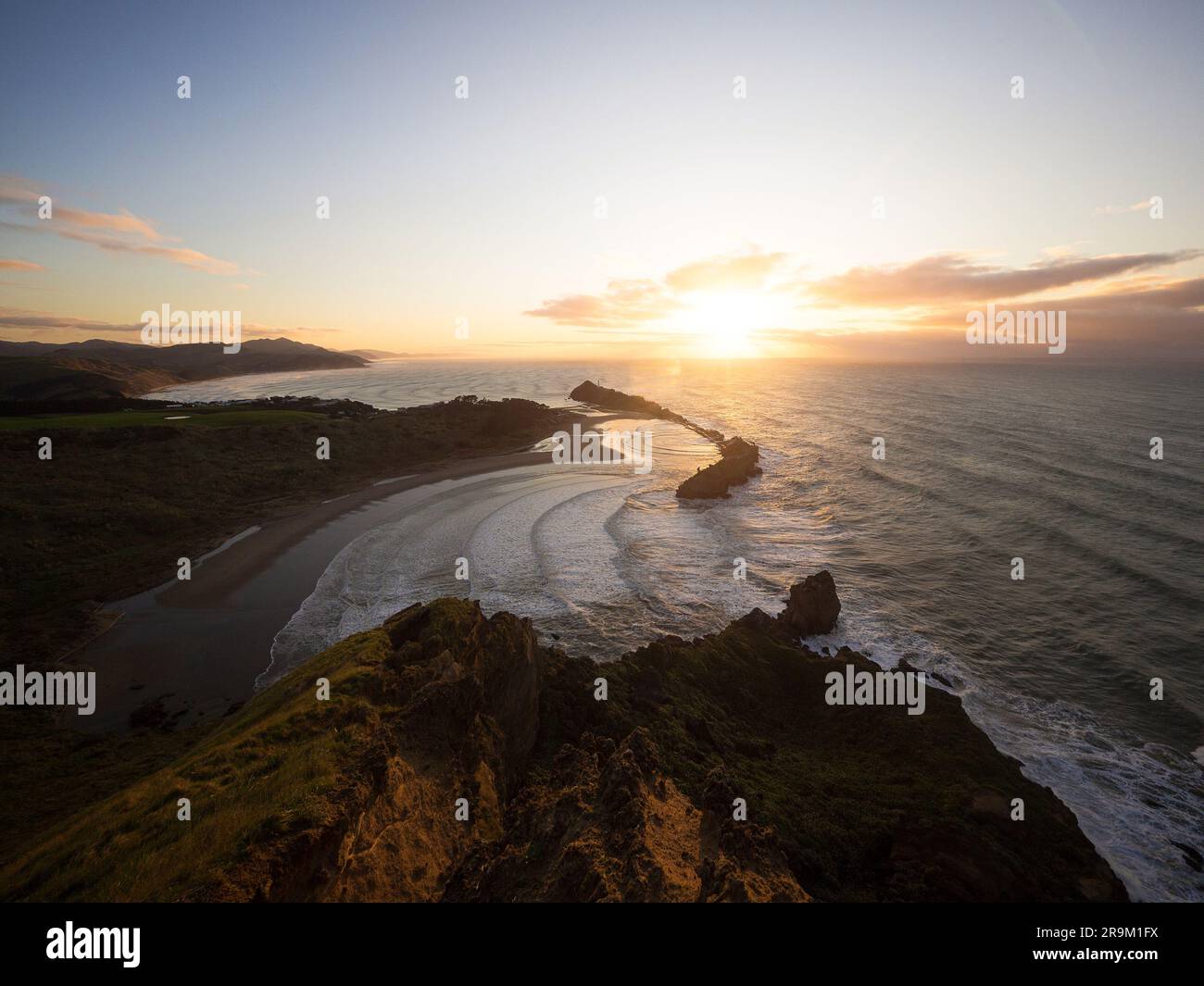 Elevated panorama view of seaside Castle Point Lighthouse on steep ...