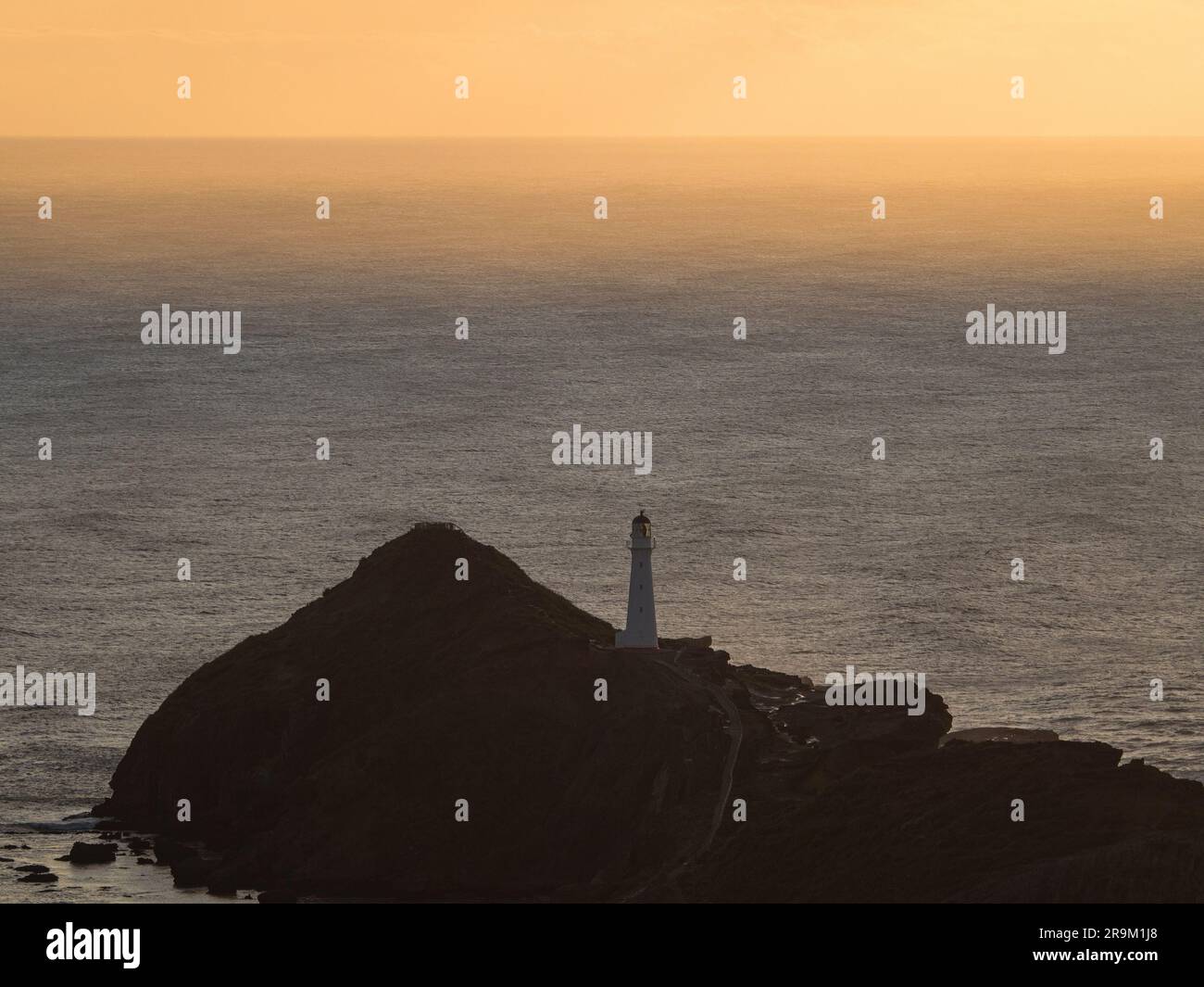 Elevated panorama view of seaside Castle Point Lighthouse on steep ...