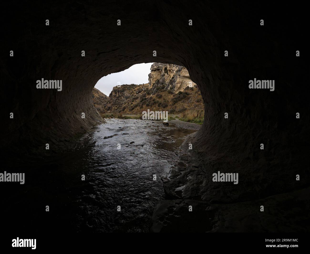 Entrance opening hole of dark black natural water tunnel at Broken ...