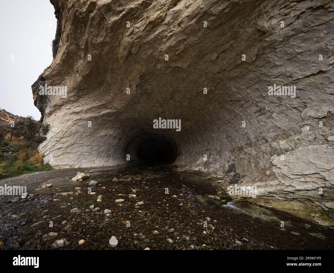 Entrance opening hole of dark black natural water tunnel at Broken ...