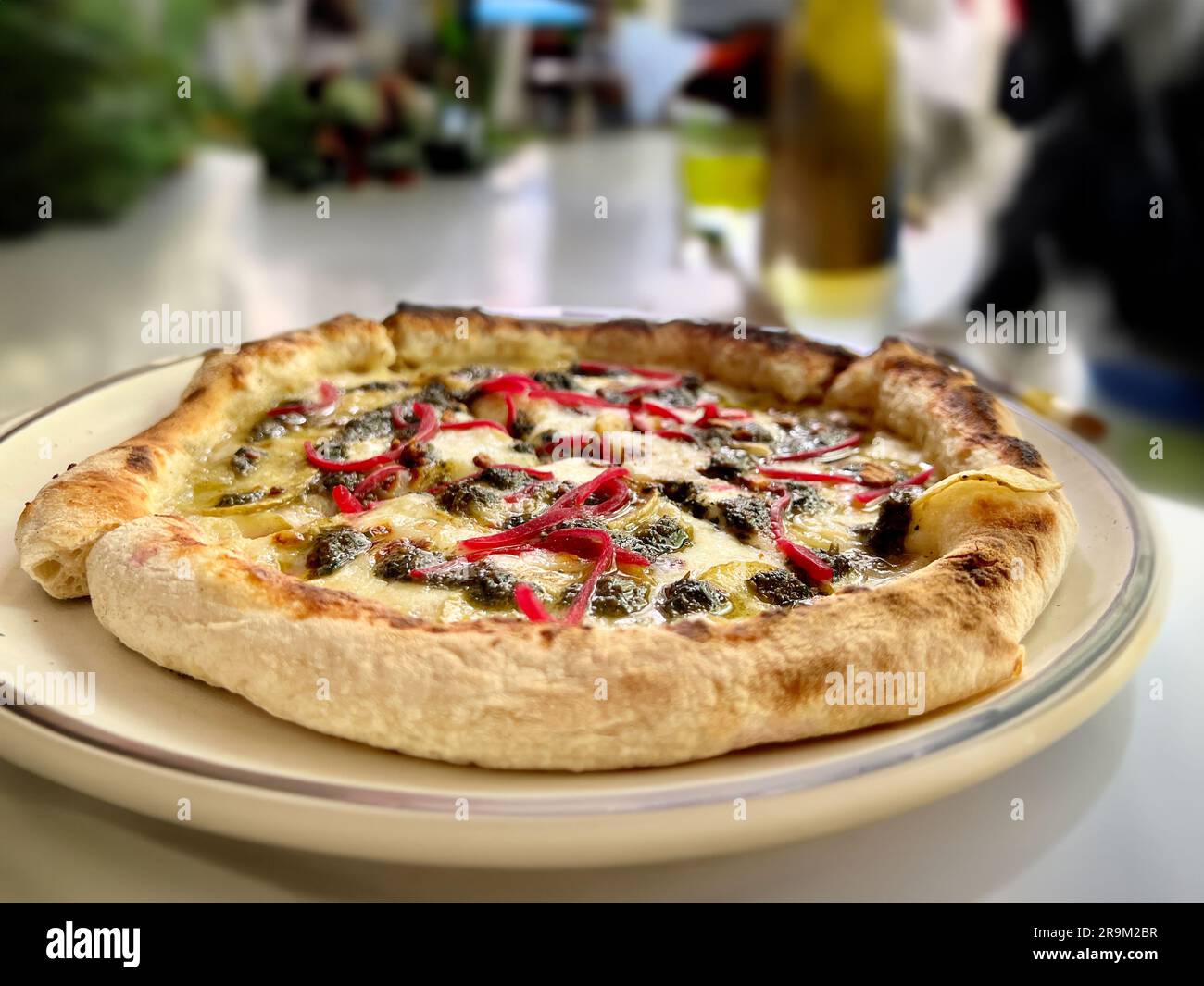 An inviting close-up shot of a rustic Italian pizza, individual size ...