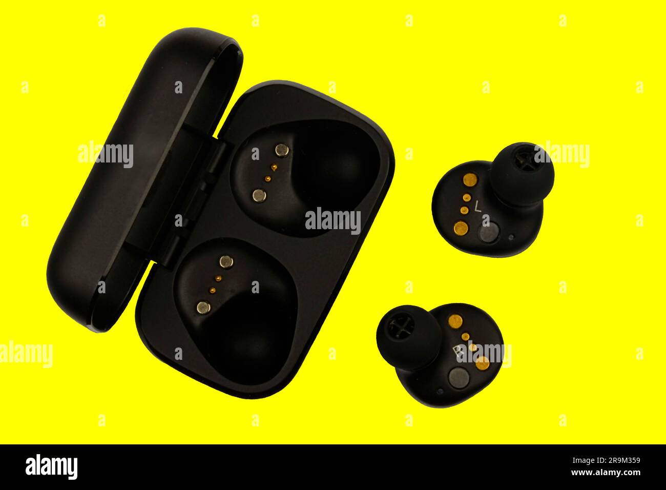 Wireless stereo earbuds. Black wireless earphones and charging case ...