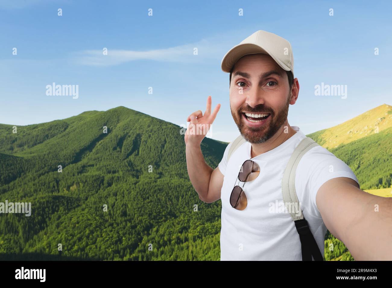 Man showing peace sign in hi-res stock photography and images - Alamy