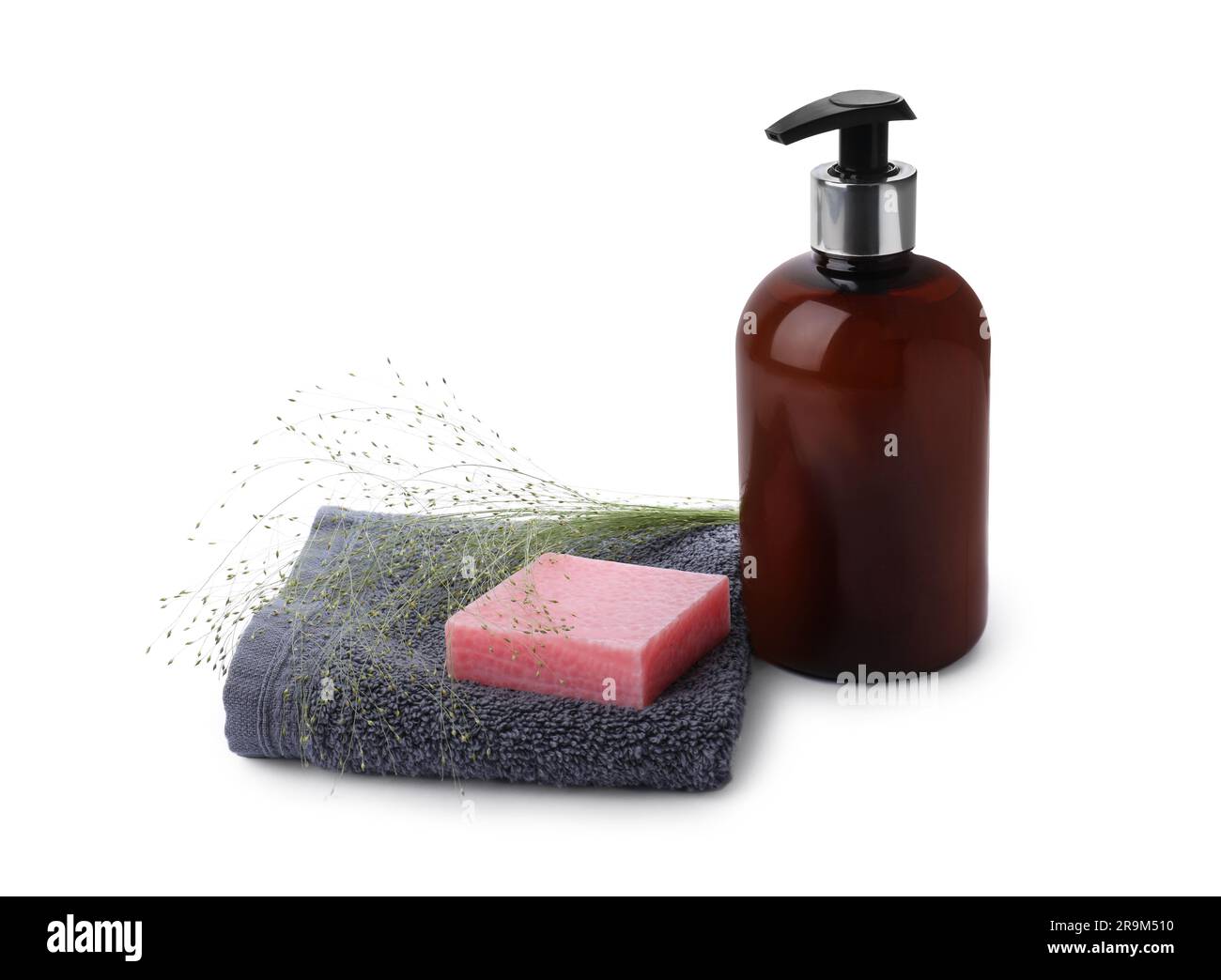 Soap bar, dispenser and terry towel on white background Stock Photo - Alamy
