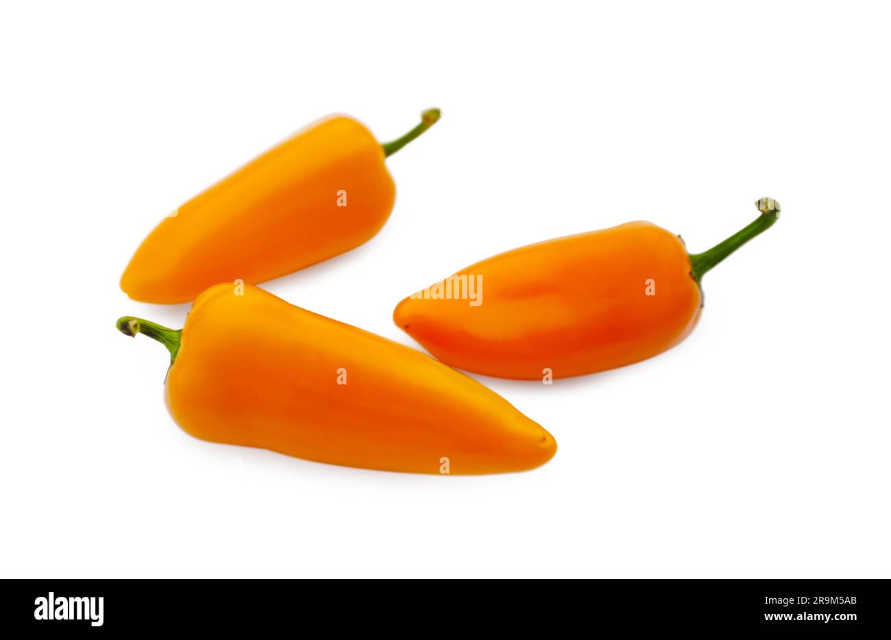 Fresh raw orange hot chili peppers isolated on white Stock Photo - Alamy
