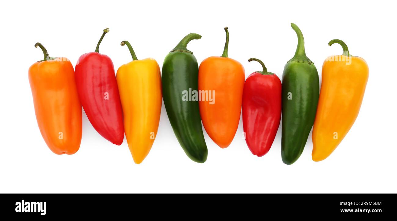 Different hot chili peppers isolated on white, top view Stock Photo - Alamy