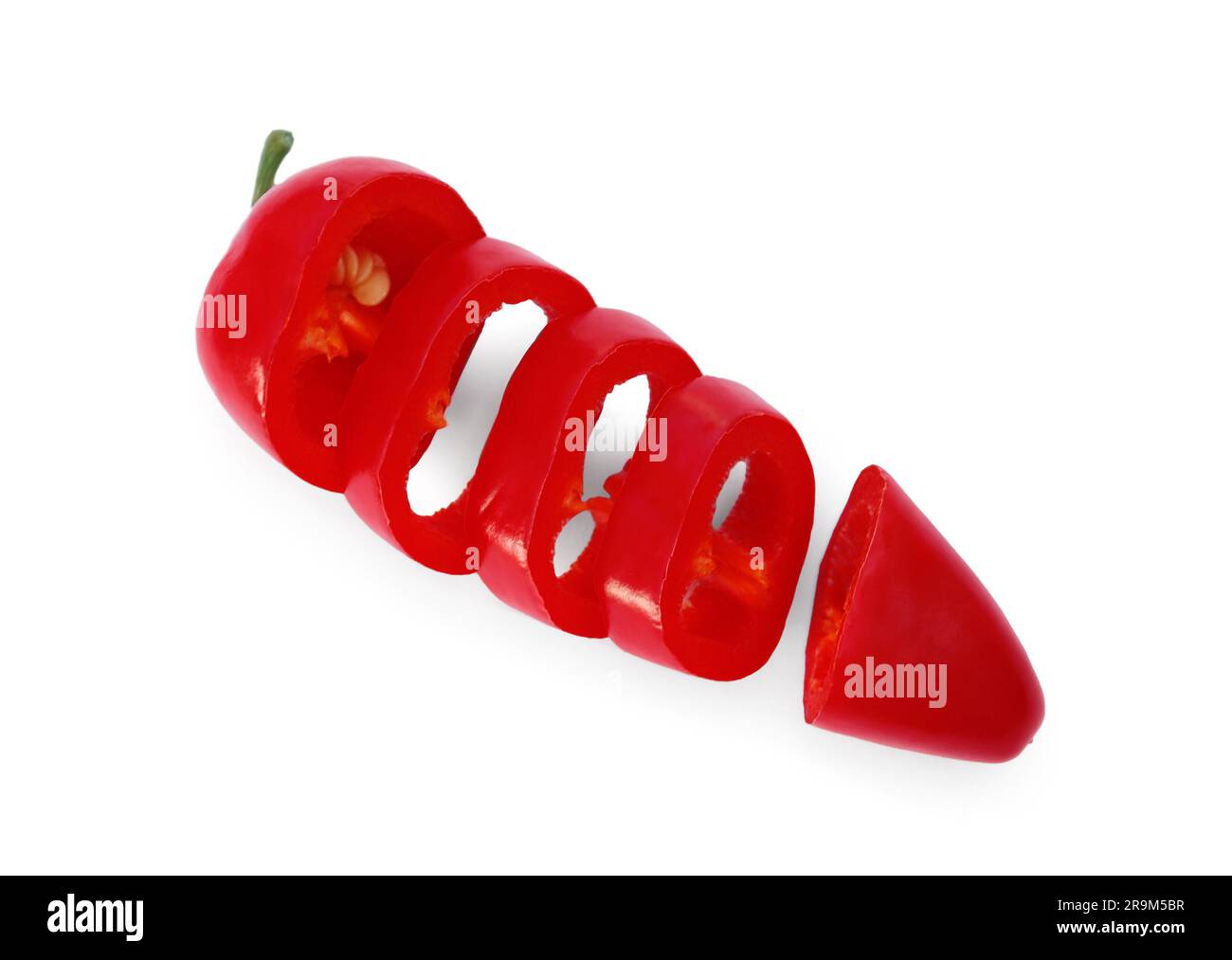 Cut red hot chili pepper isolated on white, top view Stock Photo - Alamy