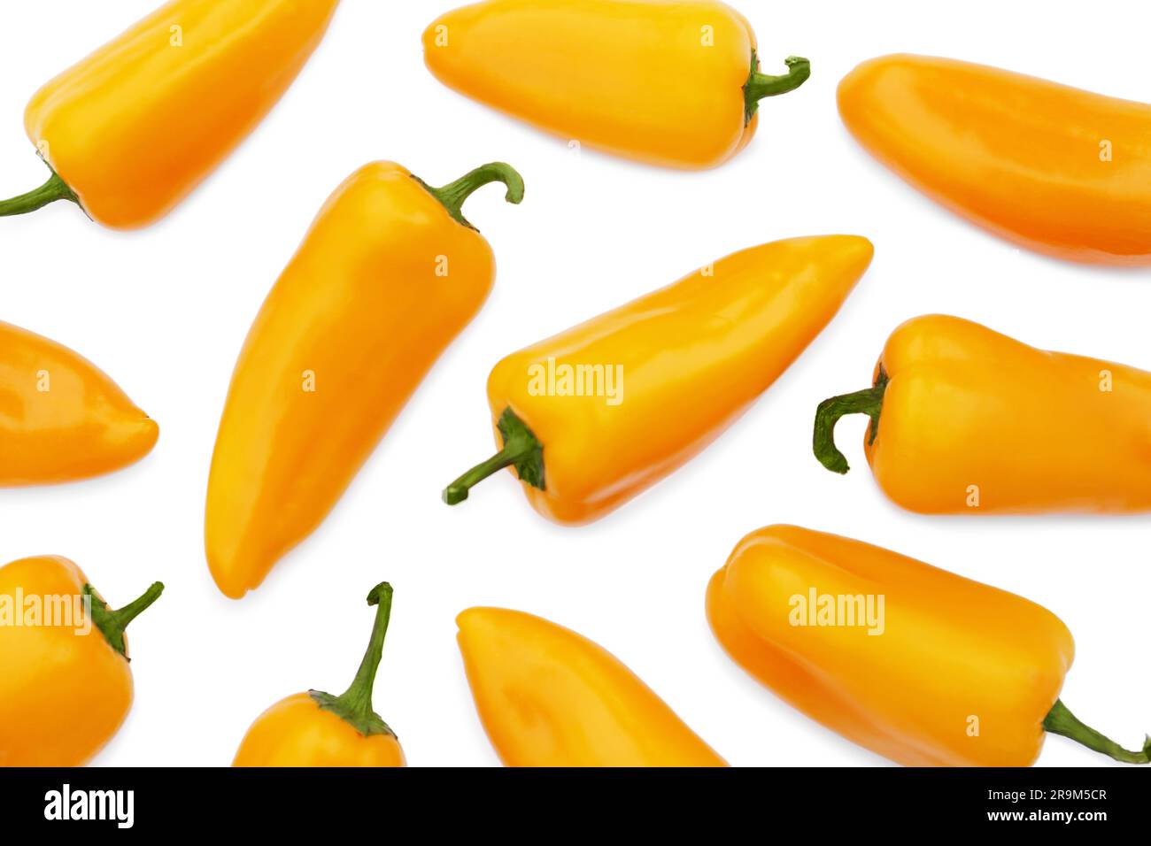 Many fresh raw orange hot chili peppers on white background, flat lay ...